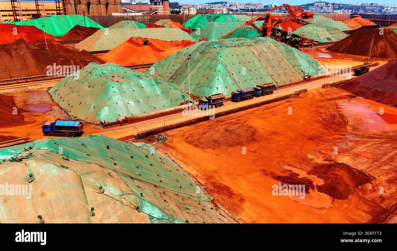 Machinery sorts and transports iron ore at Qingdao Port ore terminal in ...