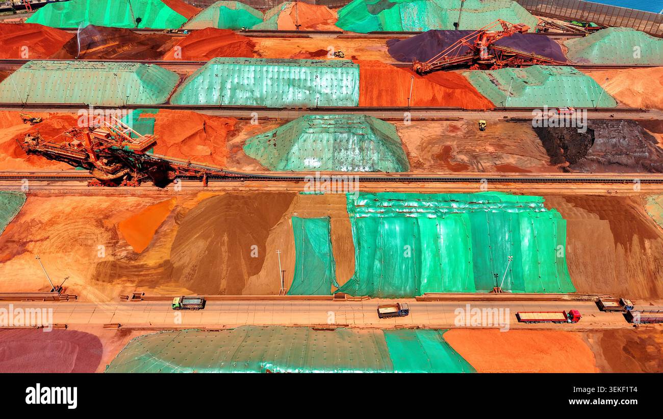 Machinery sorts and transports iron ore at Qingdao Port ore terminal in ...