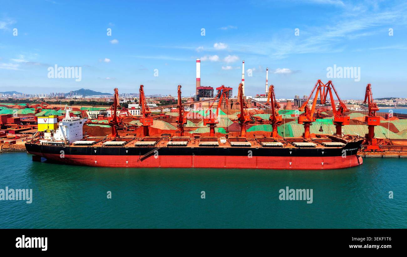 Machinery sorts and transports iron ore at Qingdao Port ore terminal in ...