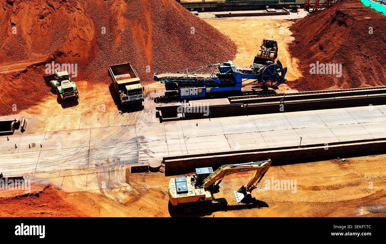 Machinery sorts and transports iron ore at Qingdao Port ore terminal in ...