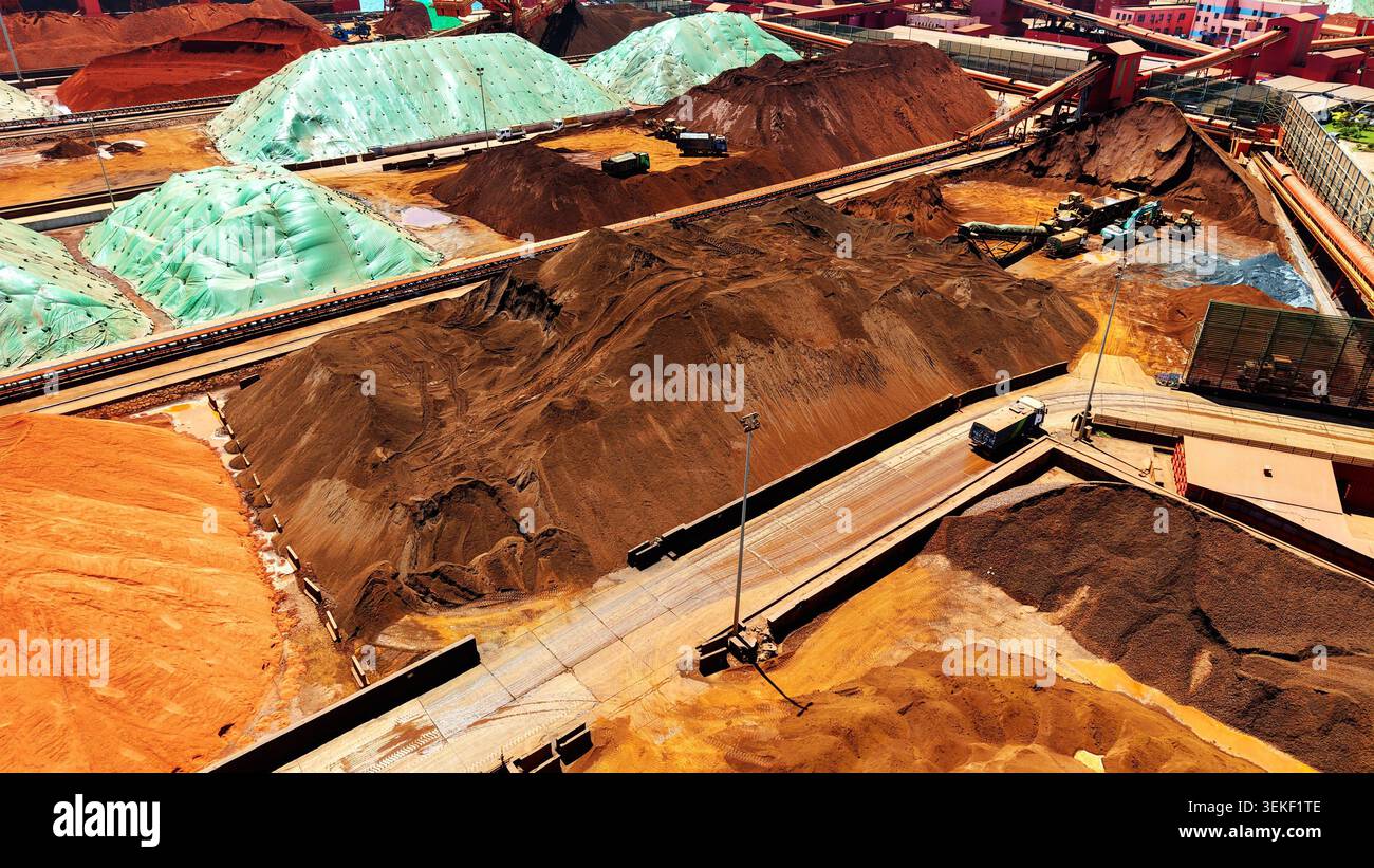 Machinery sorts and transports iron ore at Qingdao Port ore terminal in ...
