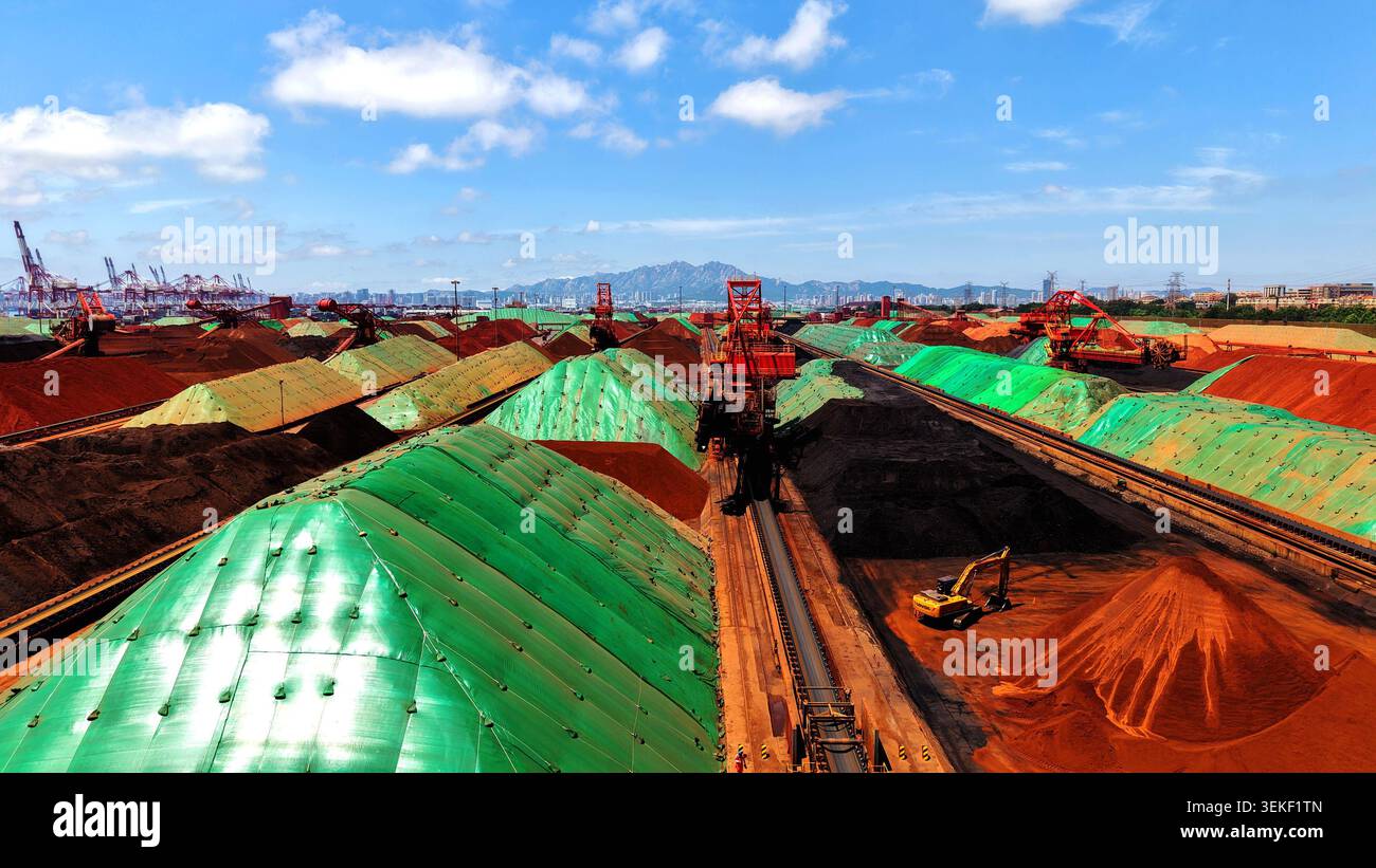 Machinery sorts and transports iron ore at Qingdao Port ore terminal in ...
