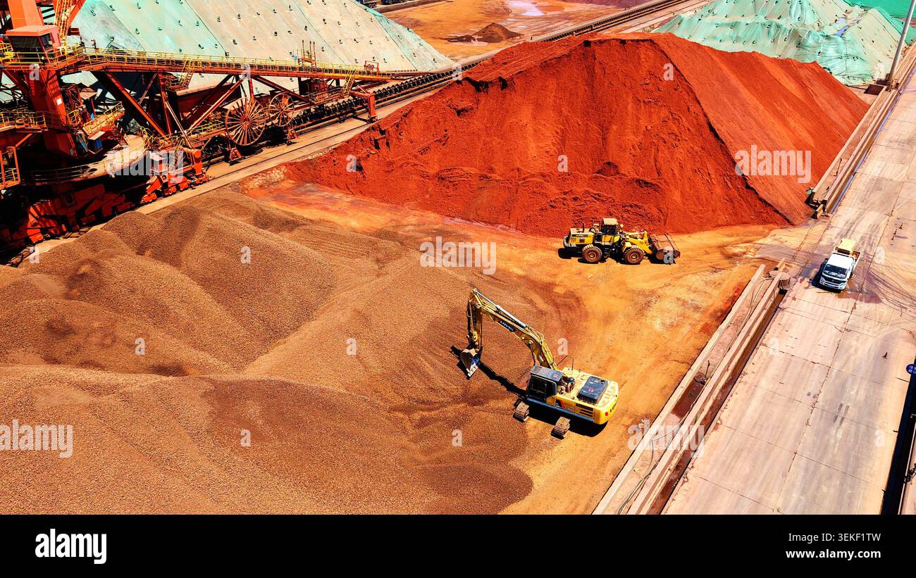 Machinery sorts and transports iron ore at Qingdao Port ore terminal in ...