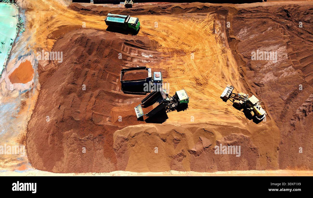 Machinery sorts and transports iron ore at Qingdao Port ore terminal in ...