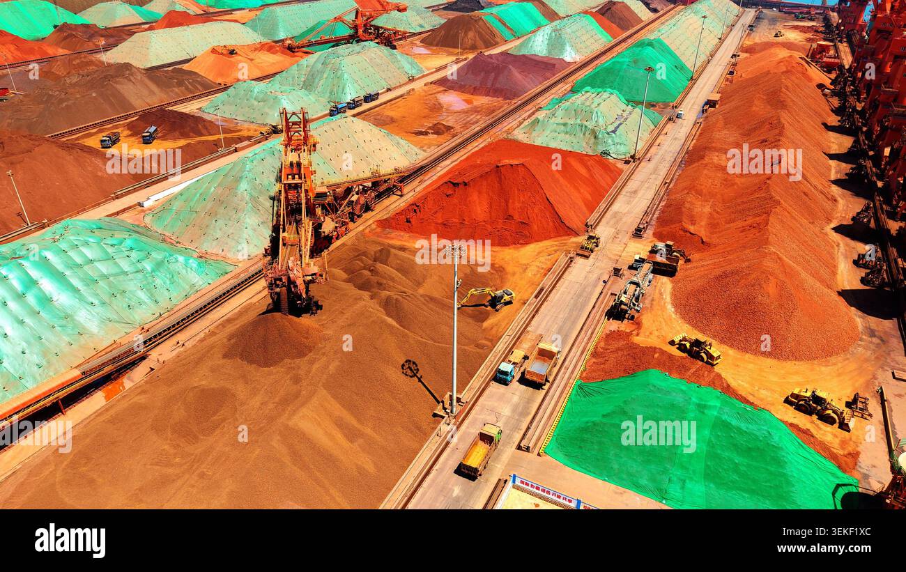 Machinery sorts and transports iron ore at Qingdao Port ore terminal in ...