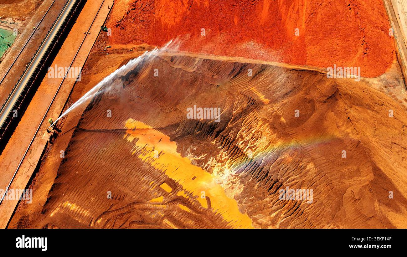 Machinery sorts and transports iron ore at Qingdao Port ore terminal in ...