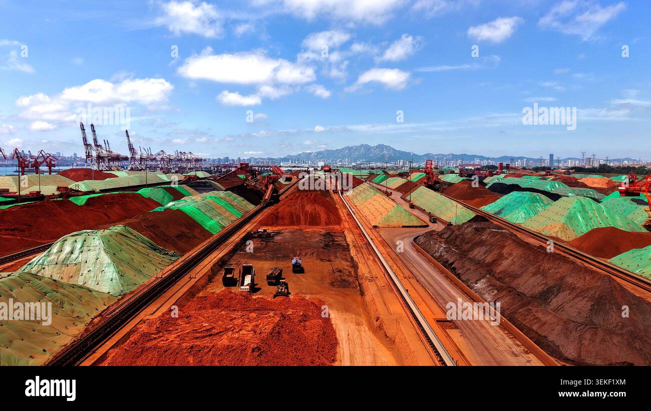 Machinery sorts and transports iron ore at Qingdao Port ore terminal in ...
