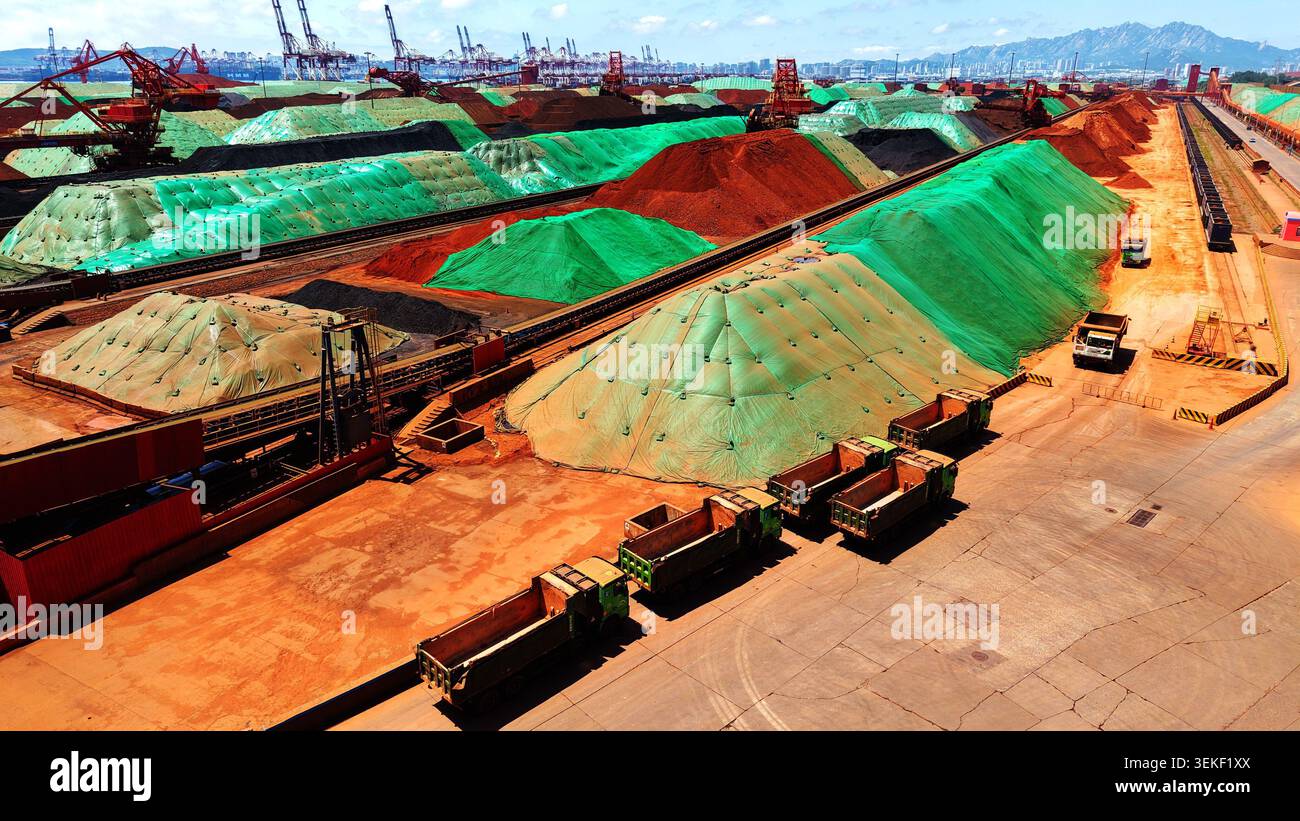 Machinery sorts and transports iron ore at Qingdao Port ore terminal in ...