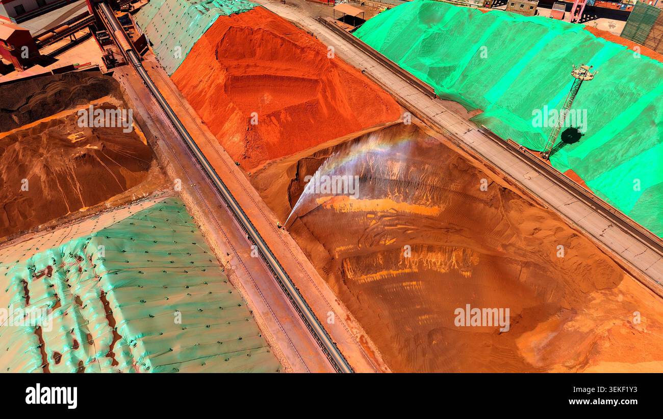 Machinery sorts and transports iron ore at Qingdao Port ore terminal in ...