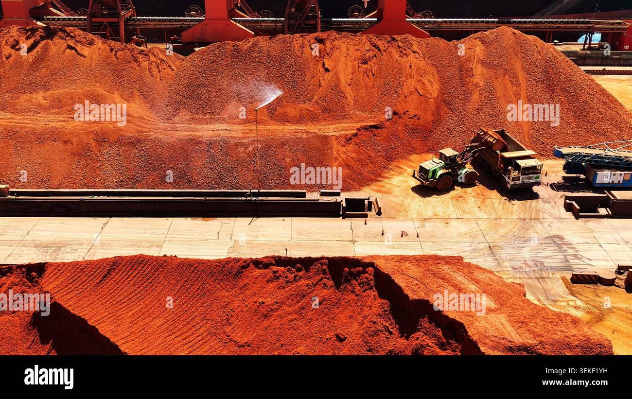 Machinery sorts and transports iron ore at Qingdao Port ore terminal in ...