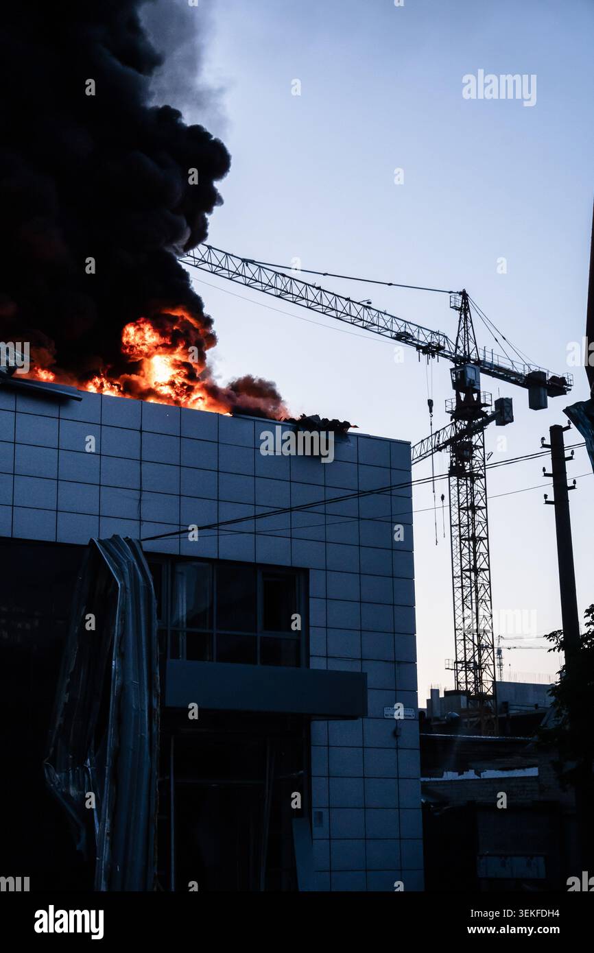 Burning building seen after a large Russian missile and drone attack in ...