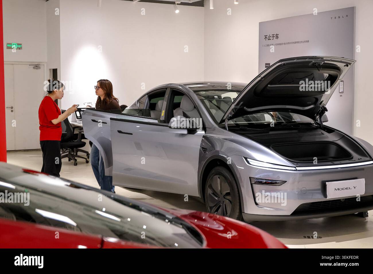 Residents test drive a Tesla Model Y at a shopping mall in Shanghai ...