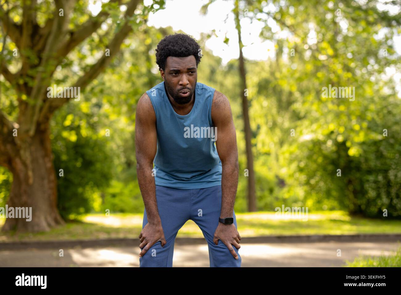 Male athlete feeling exhausted during an intense outdoor training ...