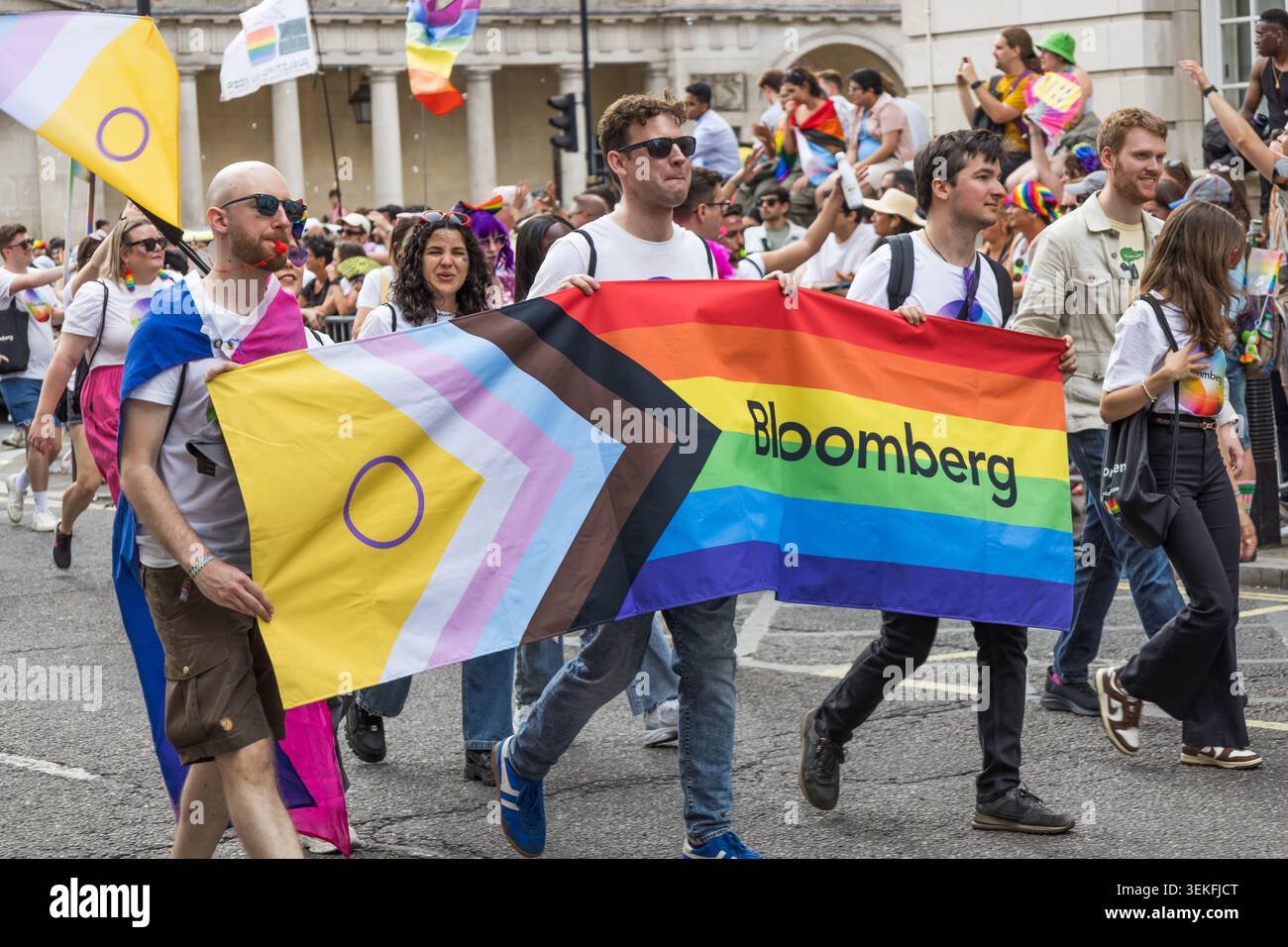 Bloomberg employees holding rainbow flag at London Pride. London, UK ...