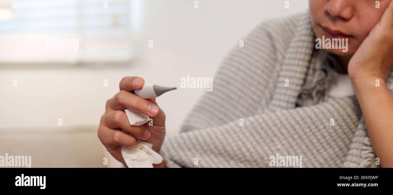 Close up Asian man holding thermometer and tissues for fever Stock ...