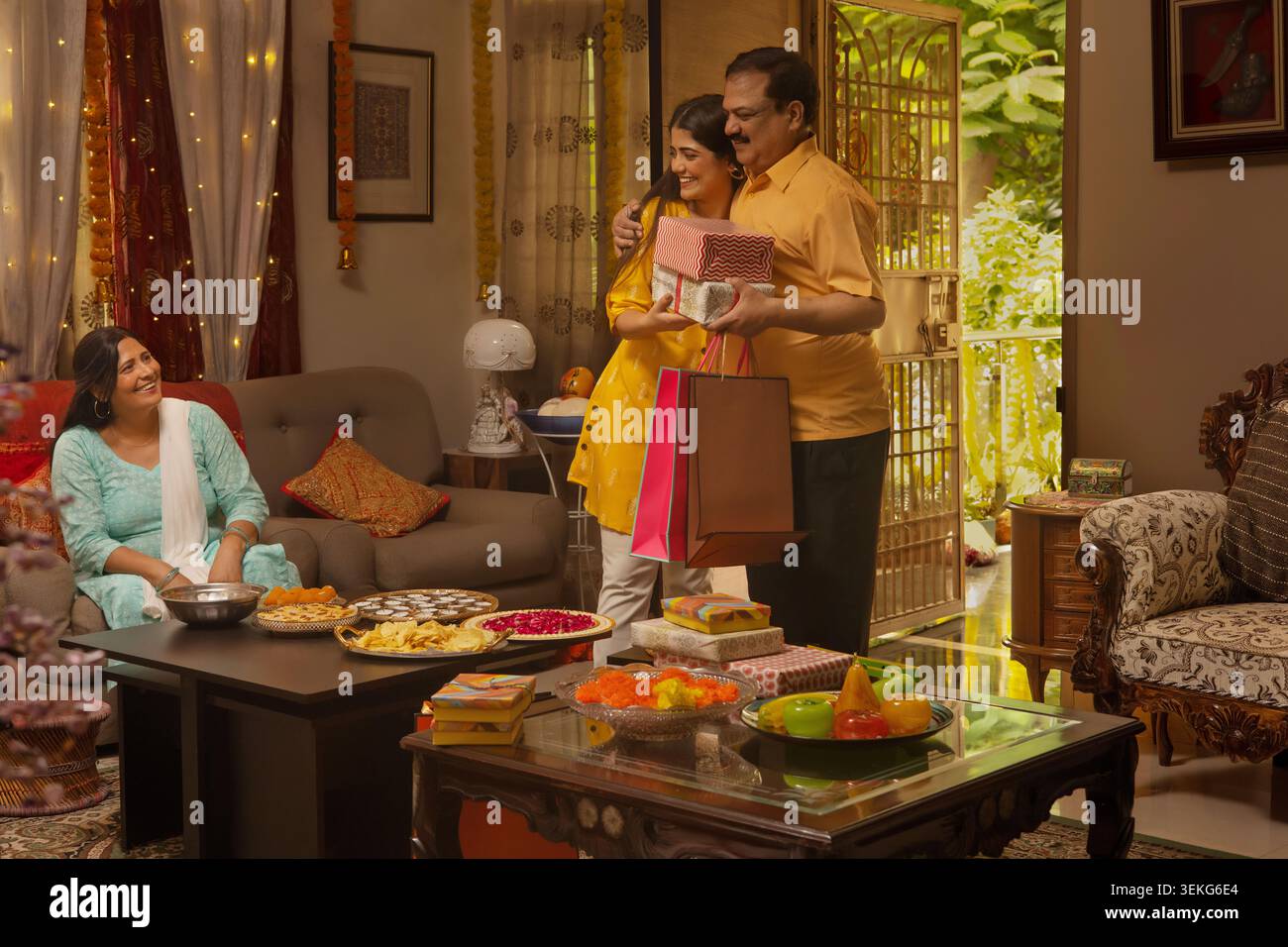 Father and Daughter embracing each other and sharing gifts on the ...