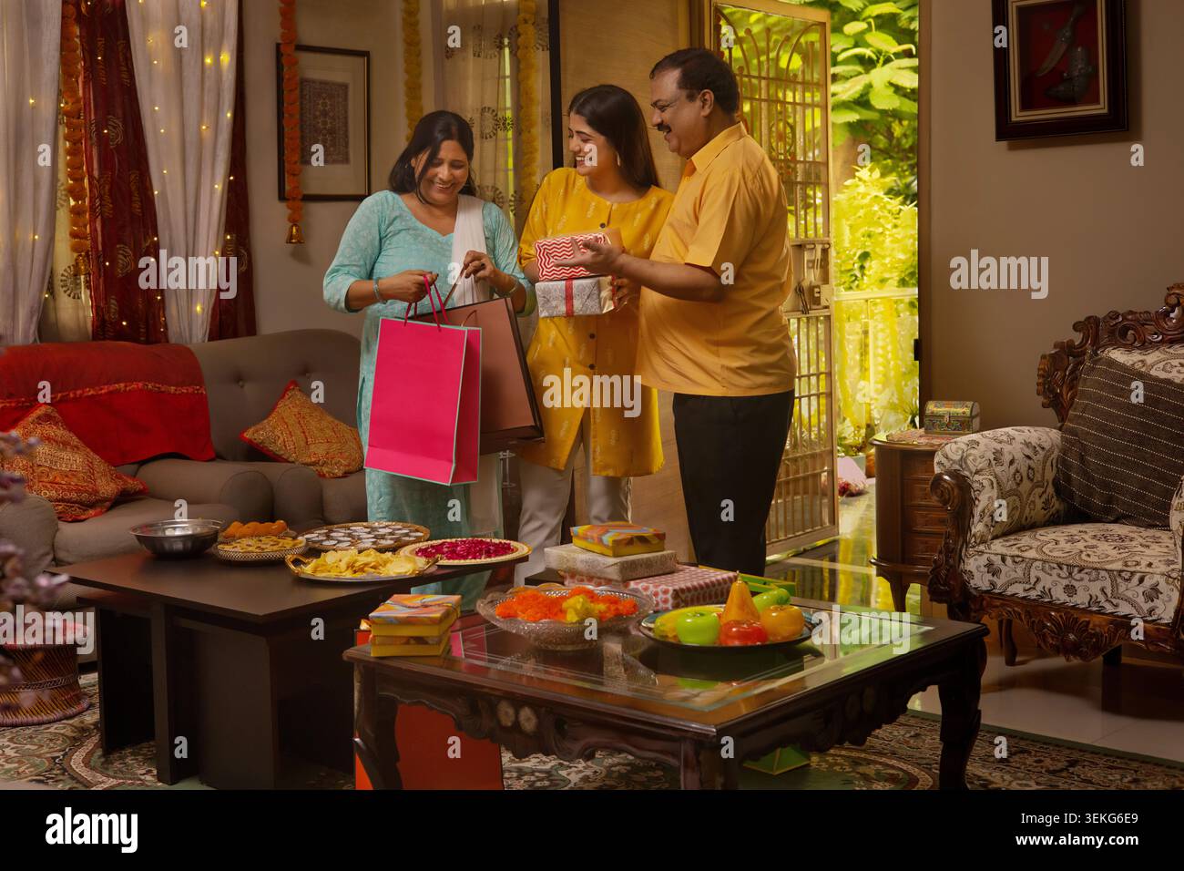 Happy family sharing gifts on the occasion of Diwali Stock Photo - Alamy