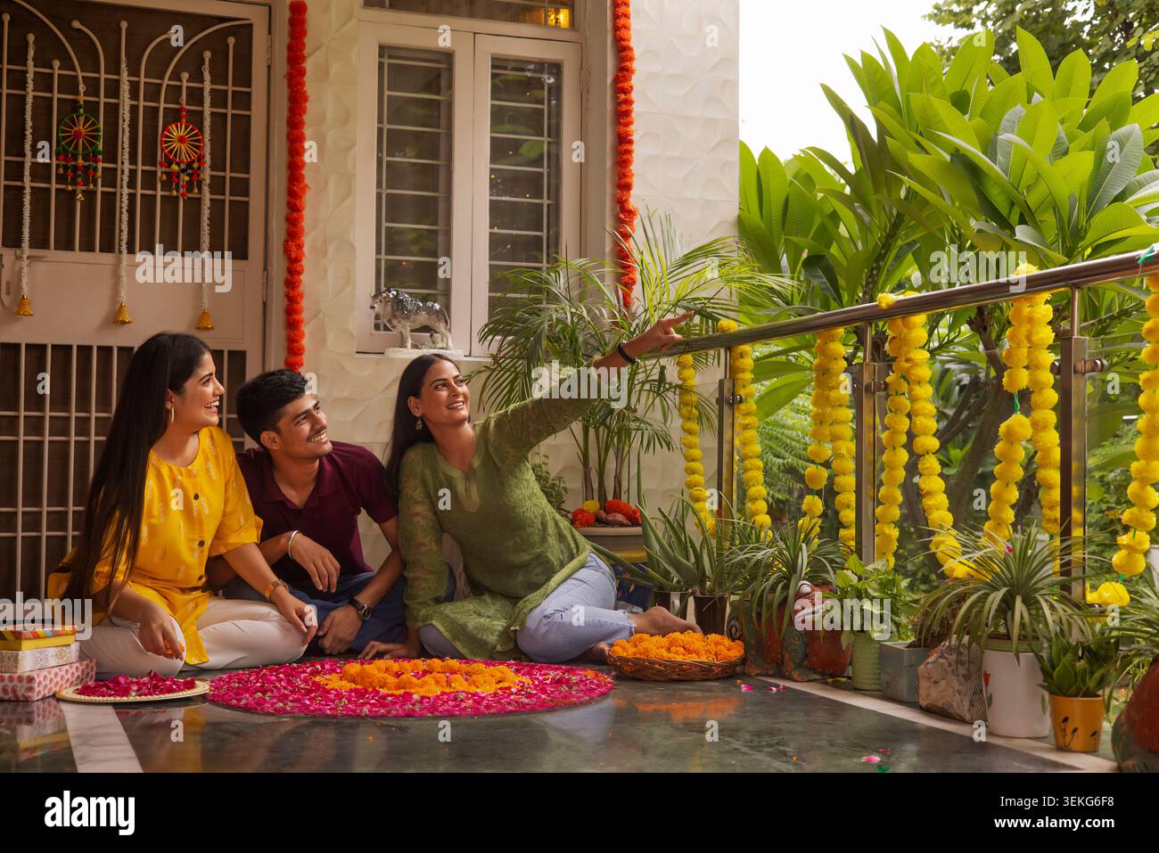 Brother and sister decorating the house together on the occasion of ...