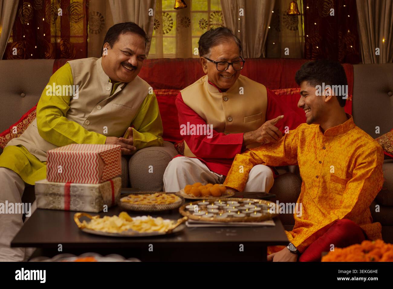 Family having fun on the occasion of Diwali while sitting together in ...