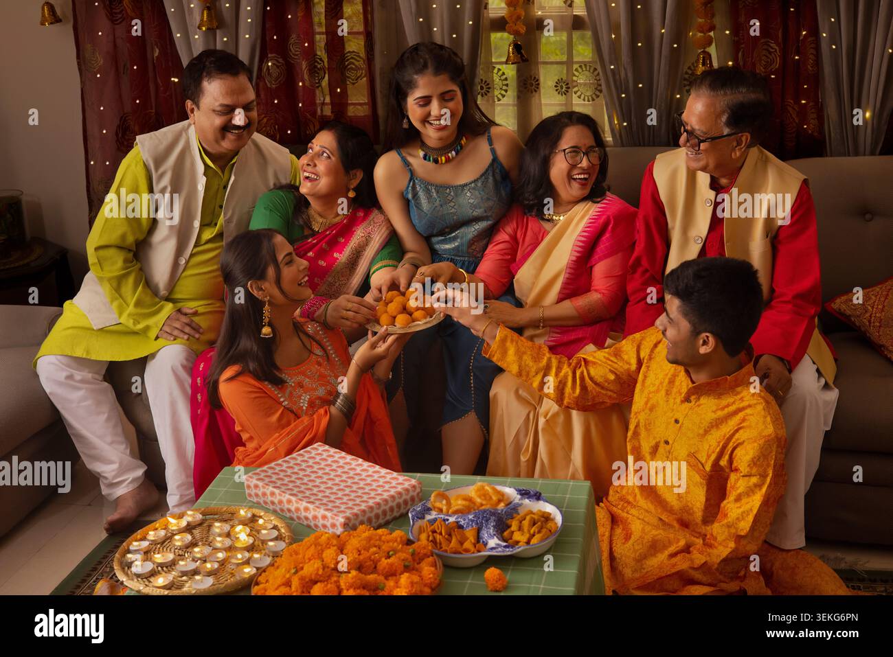 Happy Indian family celebrating Diwali together at home Stock Photo - Alamy