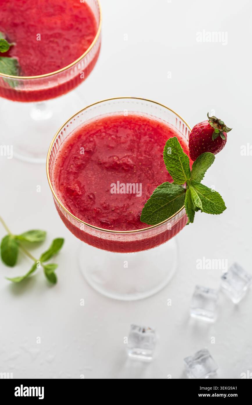 Strawberry margarita cocktails with fresh mint and whole strawberry ...