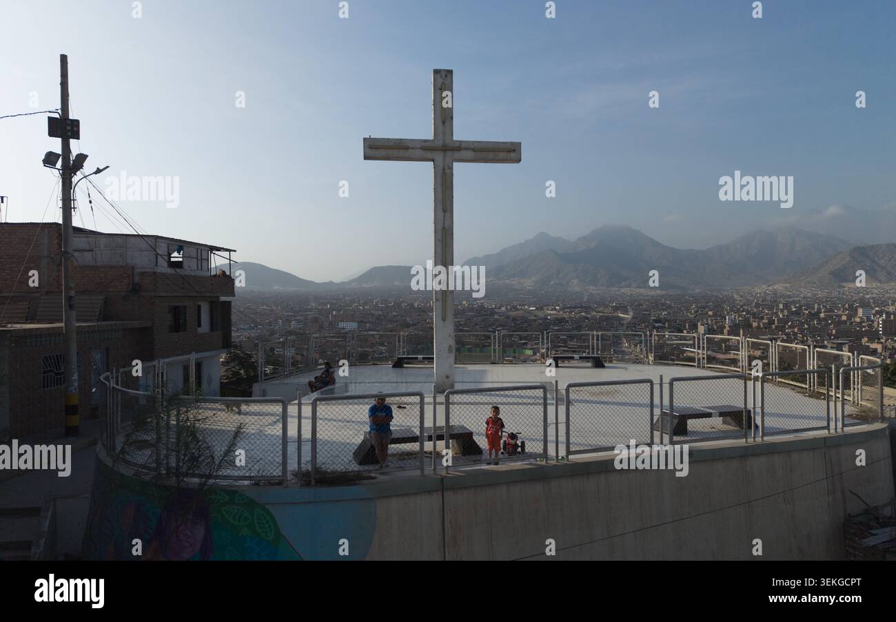 Residents stand at the Mirador overlooking the El Porvenir neighborhood ...
