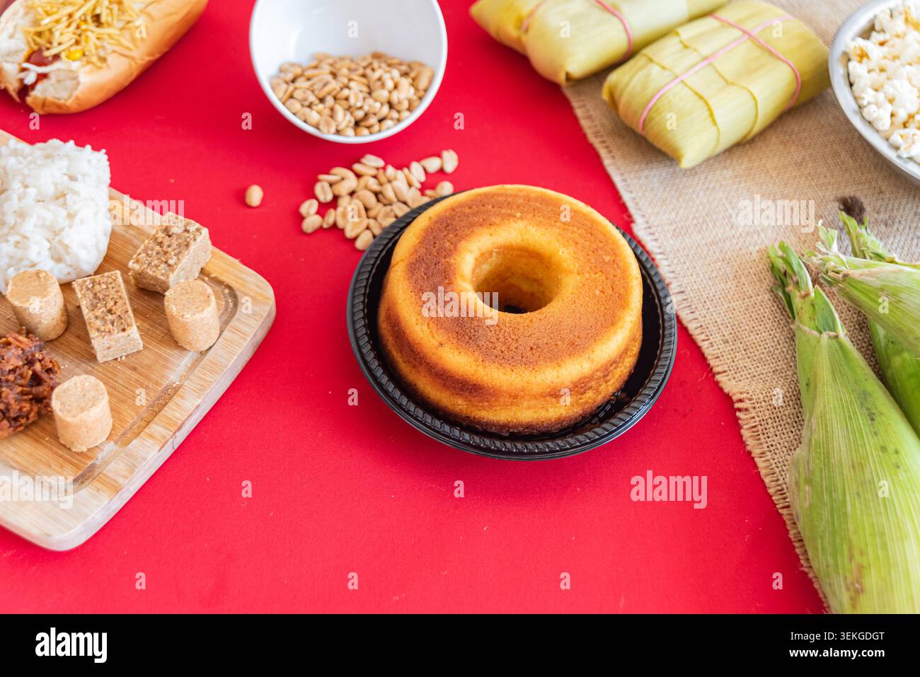 Overhead shot of typical brazilian june party foods isolated on a red ...