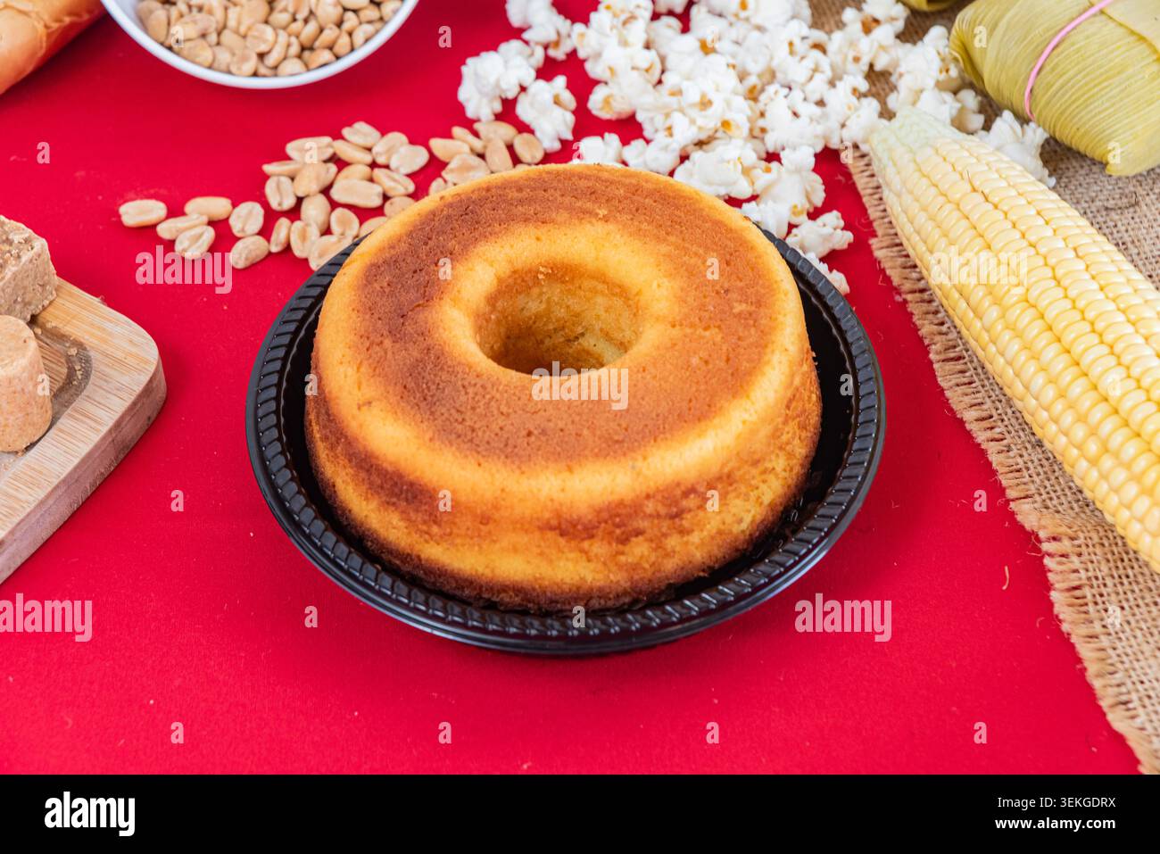 Still life showcases brazilian corn cake surrounded by peanuts, popcorn ...