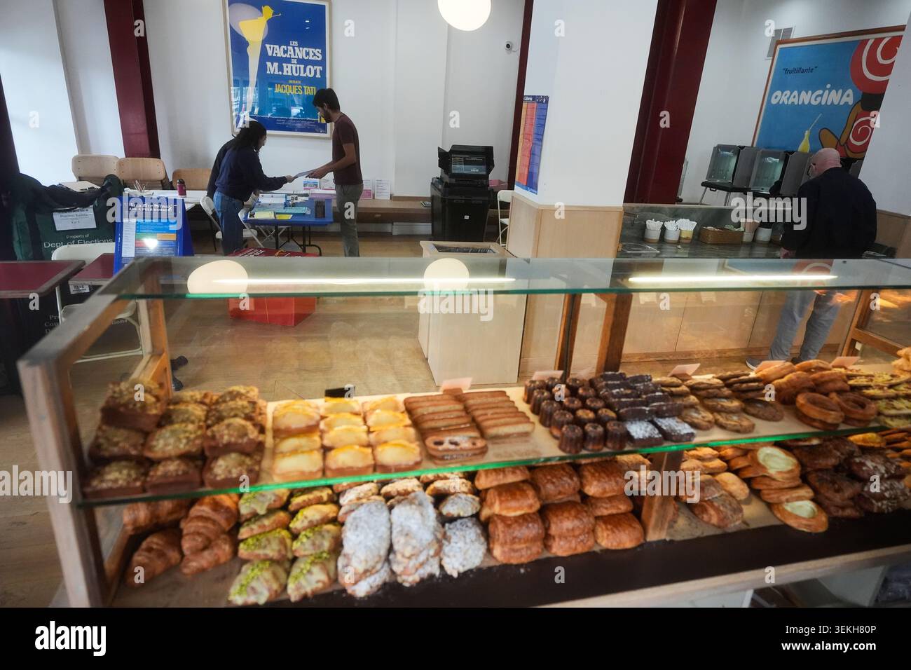 A voter casts his ballot at La Boulangerie bakery Tuesday, June 2, 2026 ...