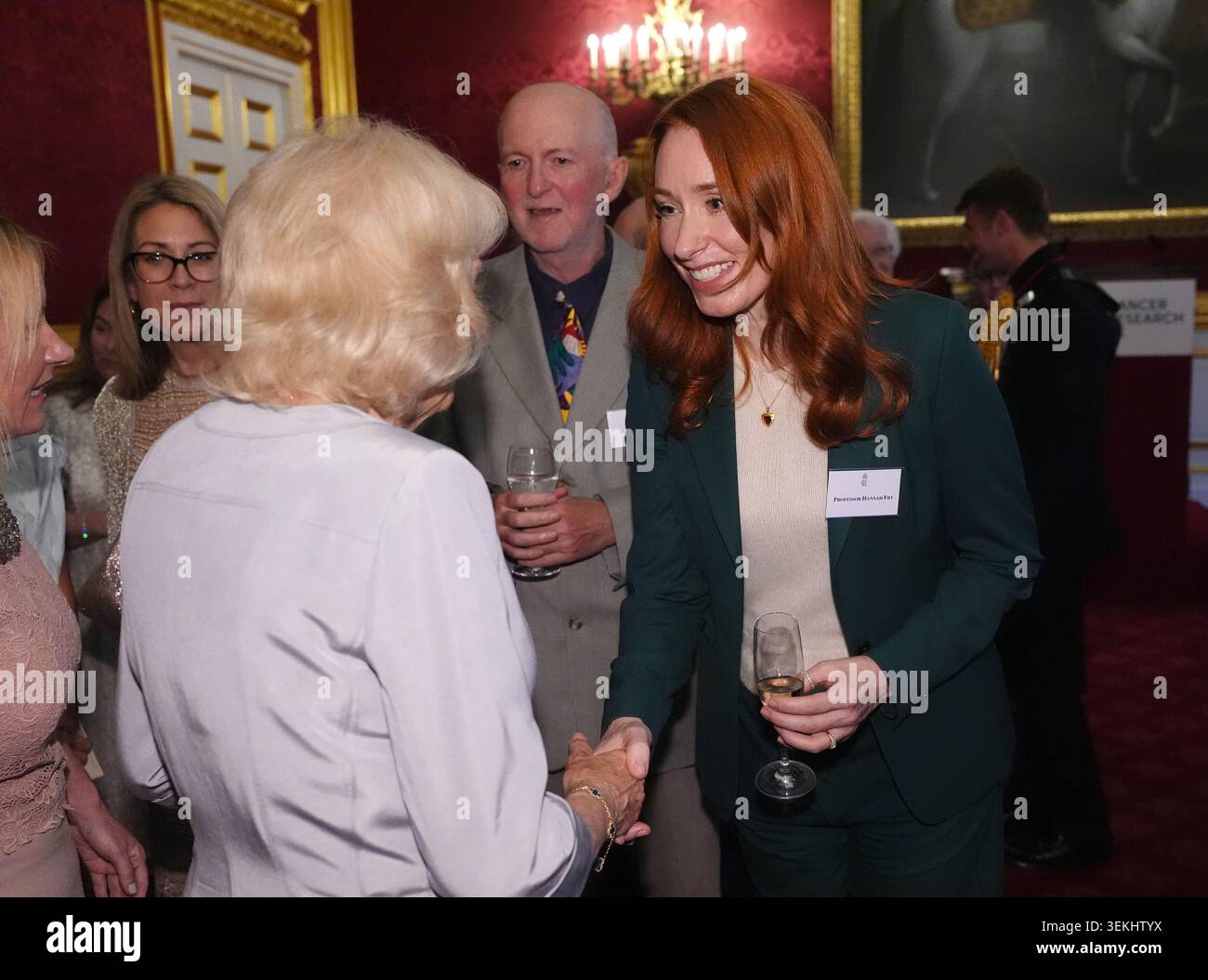 Queen Camilla speaks to Hannah Fry during a Cancer Research UK ...