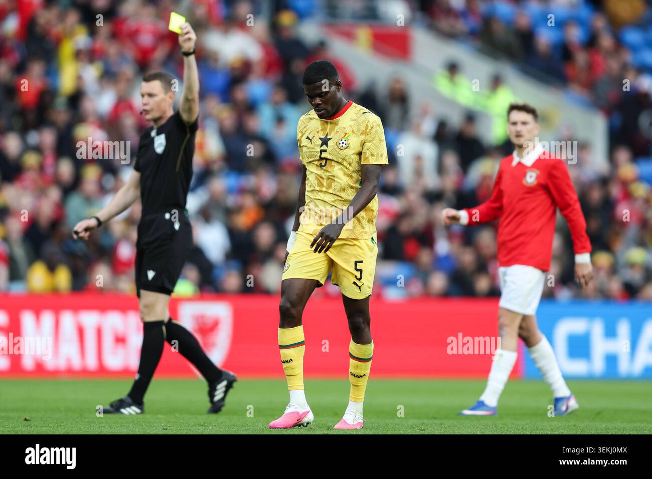 Cardiff, Wales, 2nd June 2026. Thomas Partey of Ghana is shown a yellow ...