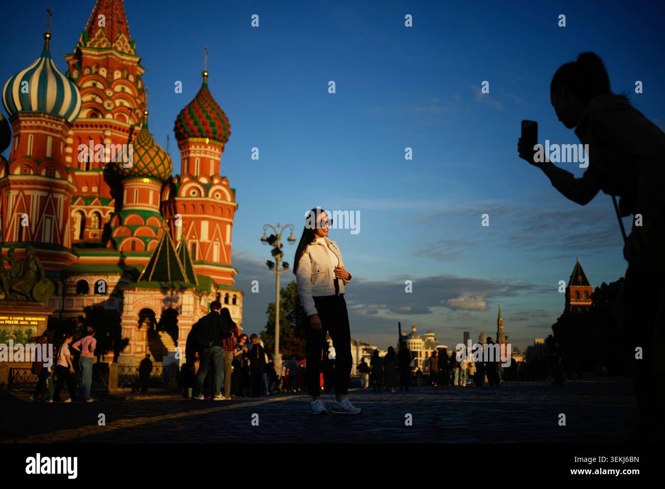 A woman poses for a photo in front of St. Basil's Cathedral at Red ...