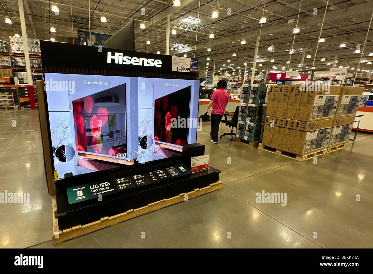 Big-screen televisons are on display for shoppers in a Costco warehouse ...