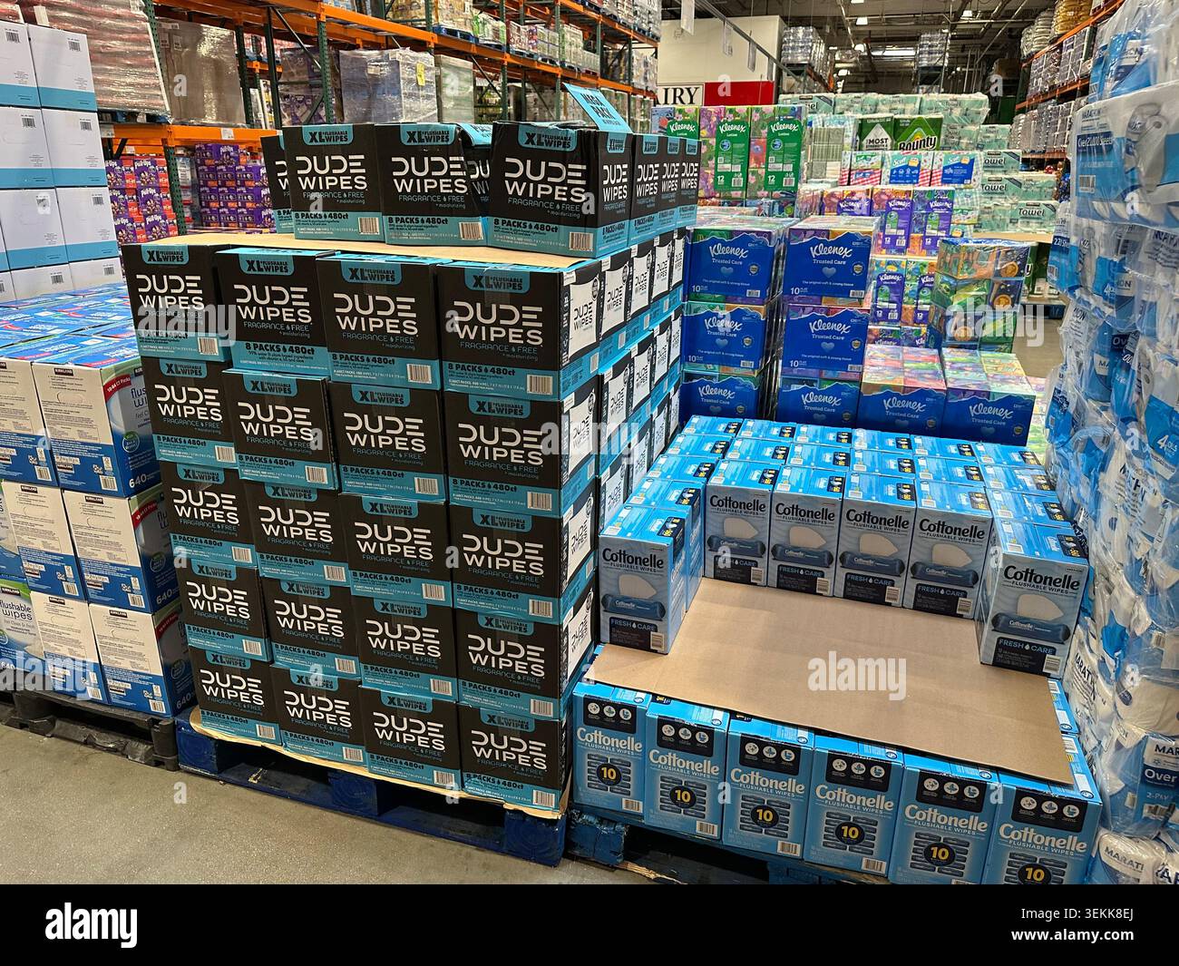 Boxes of paper products are piled high for shoppers in a Costco ...