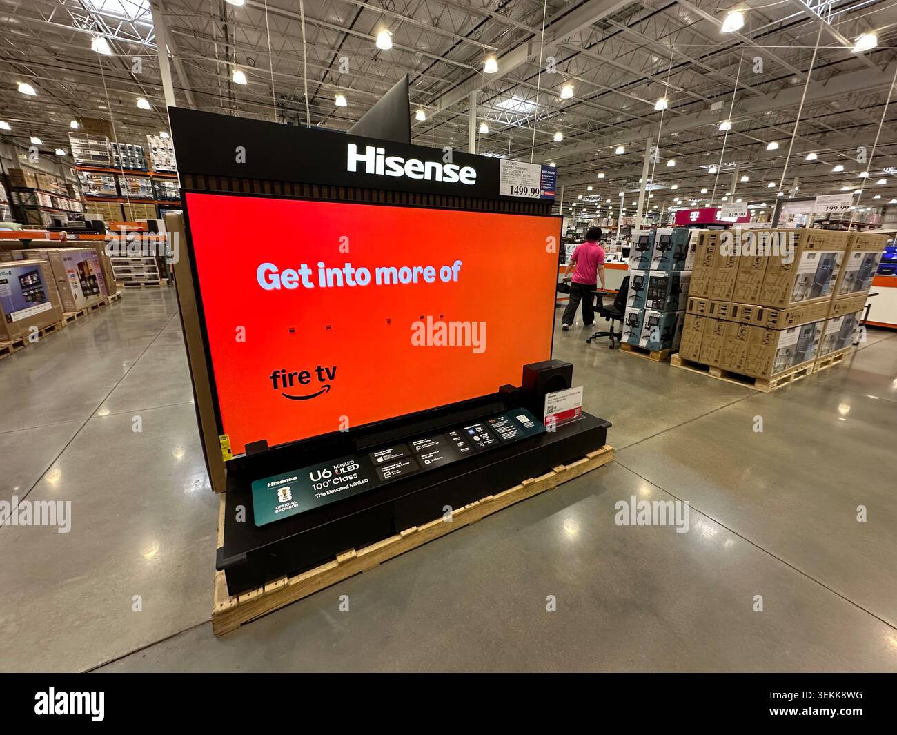 Big-screen televisions stand on display in a Costco warehouse Tuesday ...