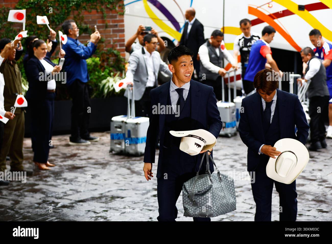 Tomoki Hayakawa, center, of the Japanese national soccer team arrives ...