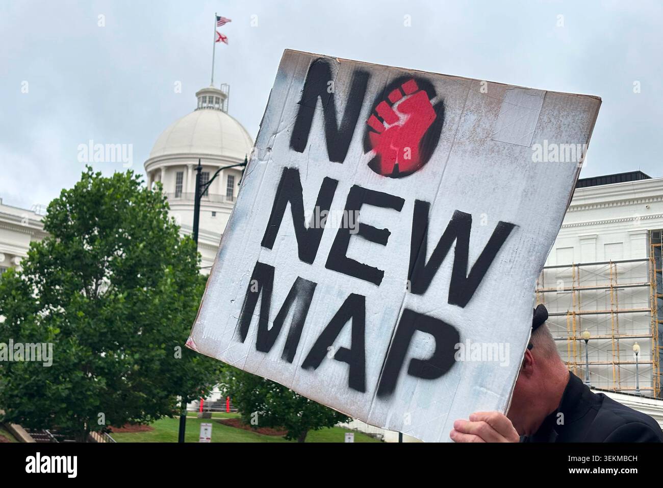 FILE -A demonstrator holds up a sign outside the Alabama Statehouse in ...