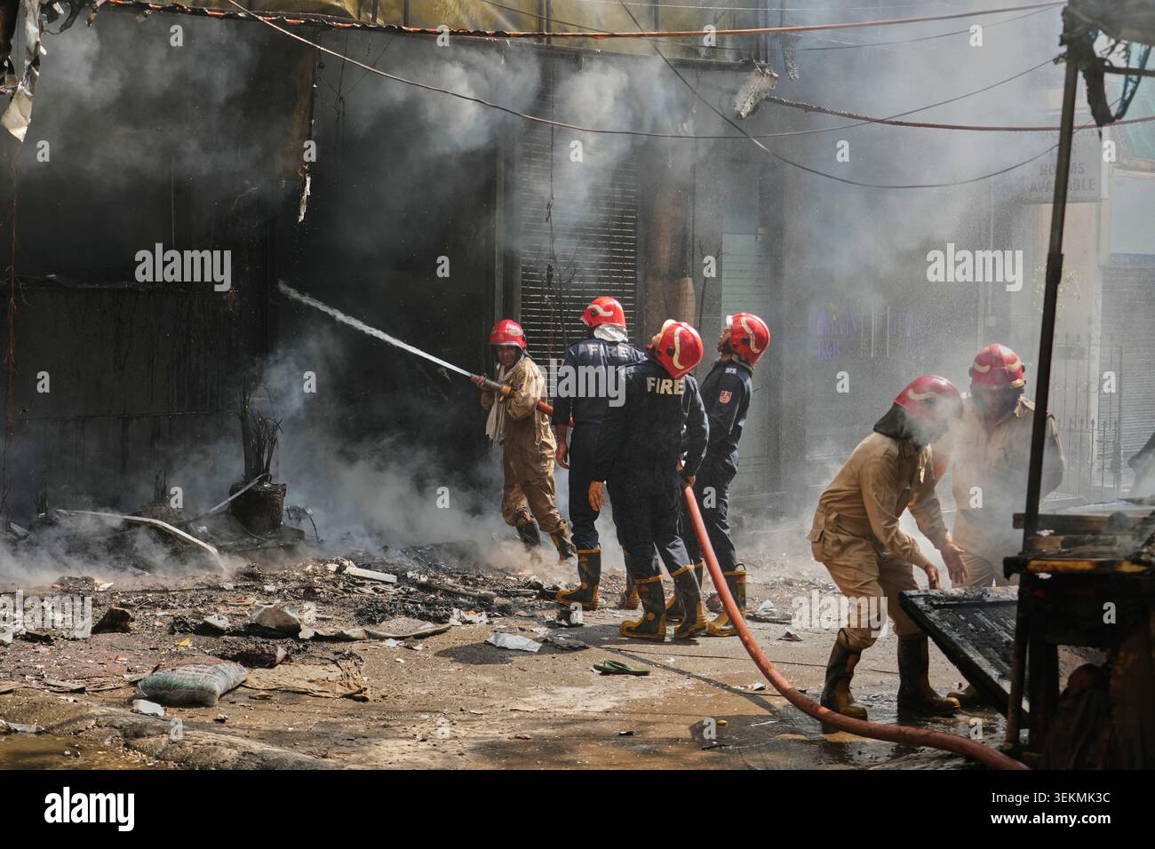 Firefighters douse a fire in a hotel in New Delhi, India, Wednesday ...