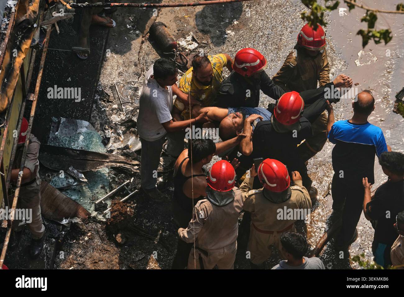Firefighters rescue a foreign national from a hotel fire in New Delhi ...