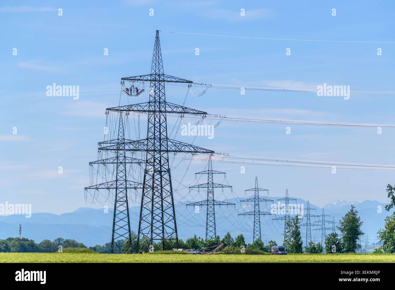 enns, austria, 02 june 2026, construction workers on a high voltage ...