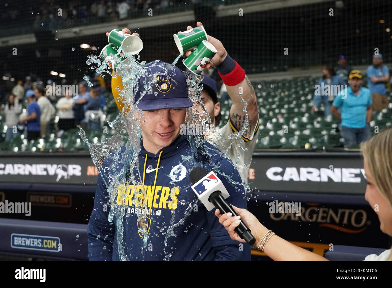 Milwaukee Brewers' Kyle Harrison gets dunked by Garrett Mitchell after ...