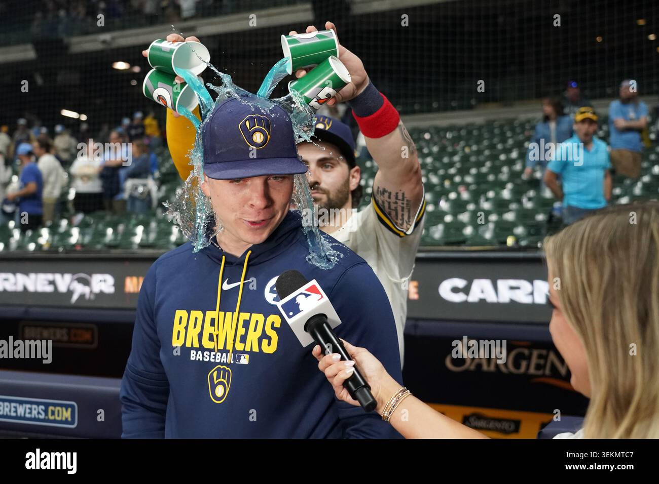 Milwaukee Brewers' Kyle Harrison gets dunked by Garrett Mitchell after ...