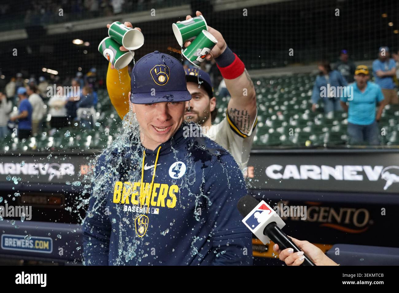 Milwaukee Brewers' Kyle Harrison gets dunked by Garrett Mitchell after ...
