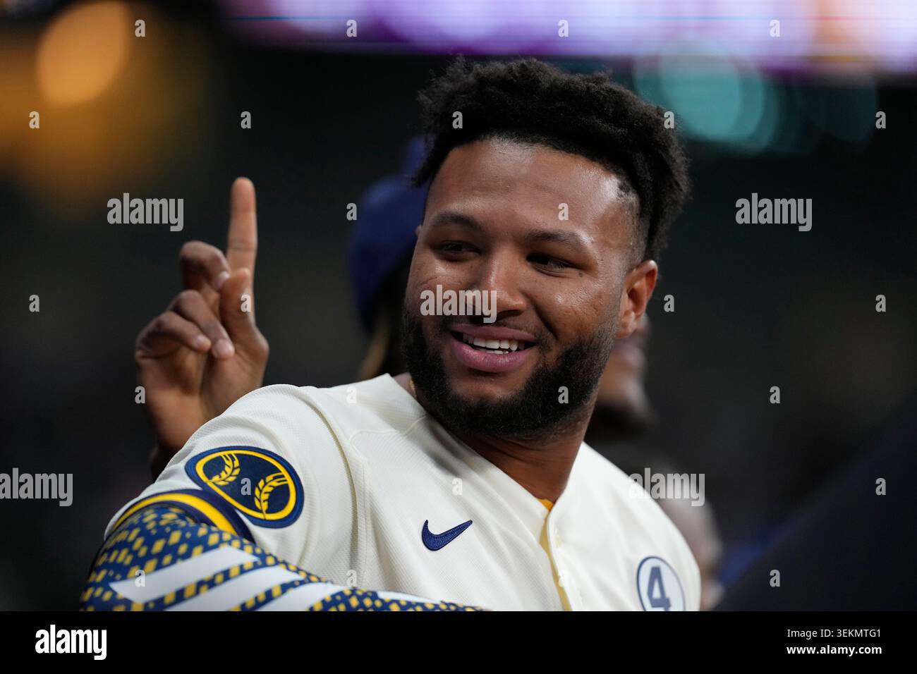 Milwaukee Brewers' Jackson Chourio smiles in the dugout during a ...