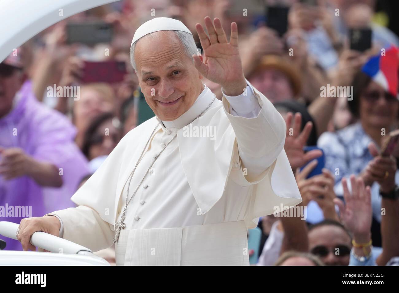 Pope Leo XIV waves as he arrives for his weekly general audience in St ...
