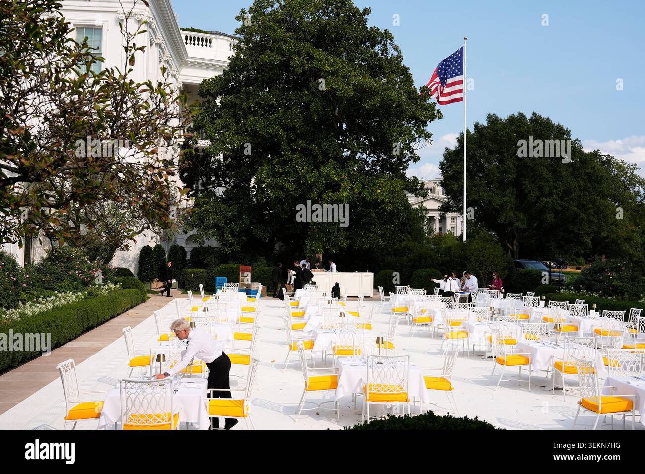 FILE - Workers prepare the Rose Garden for a dinner that will be hosted ...