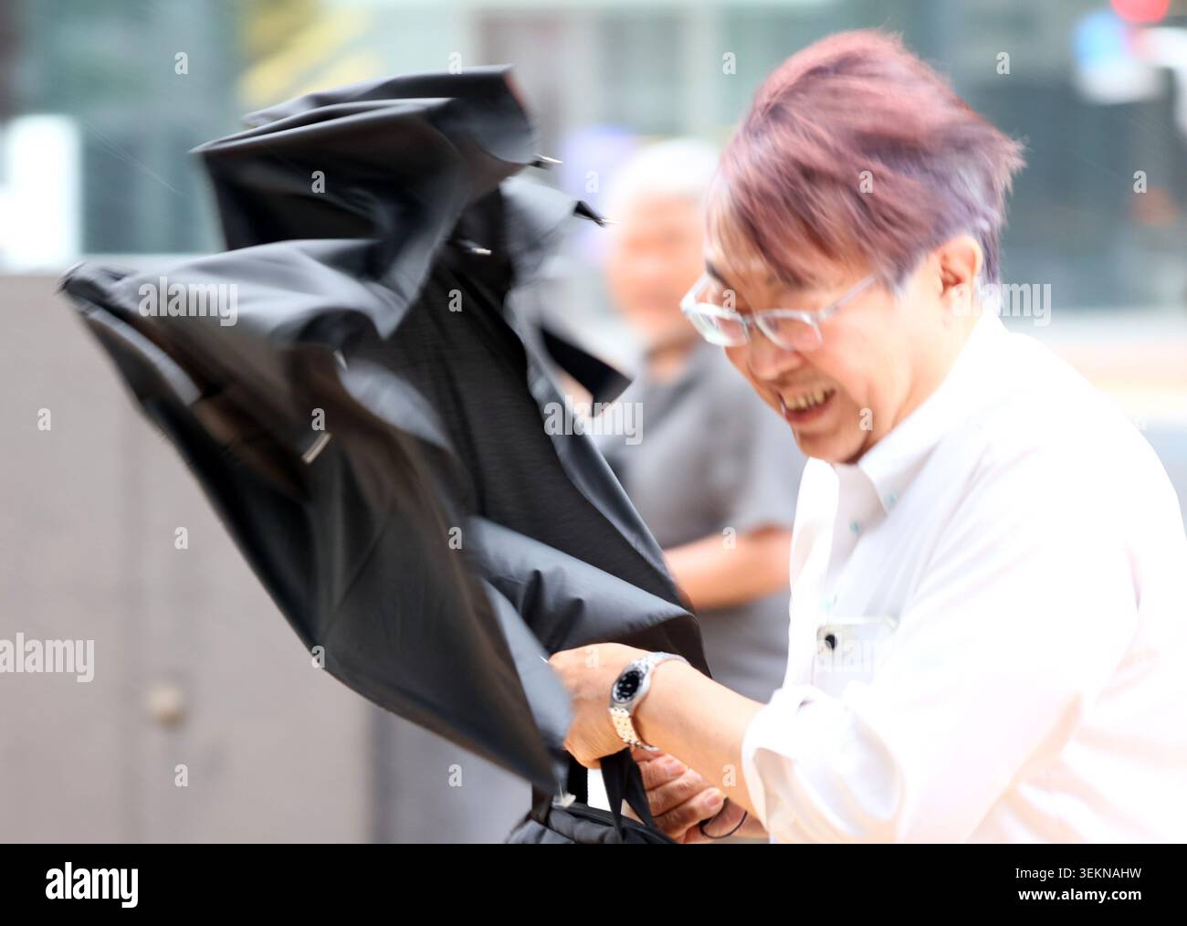 Tokyo, Japan. 3rd June, 2026. A man walks against strong wind and ...