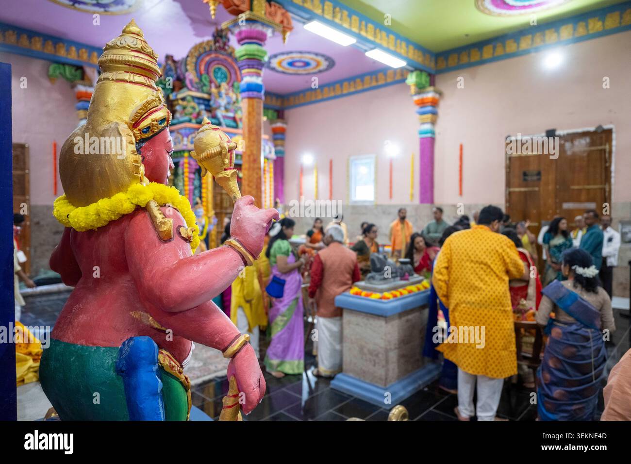 03 June 2026, Berlin: Worshippers of Hinduism stand in the Sri Ganesha ...