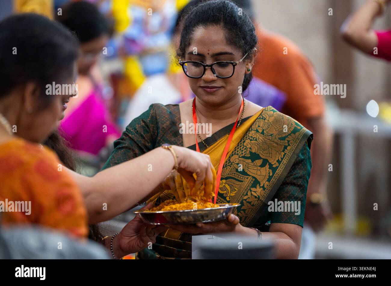 03 June 2026, Berlin: Hindu believers prepare for a ritual at the Sri ...
