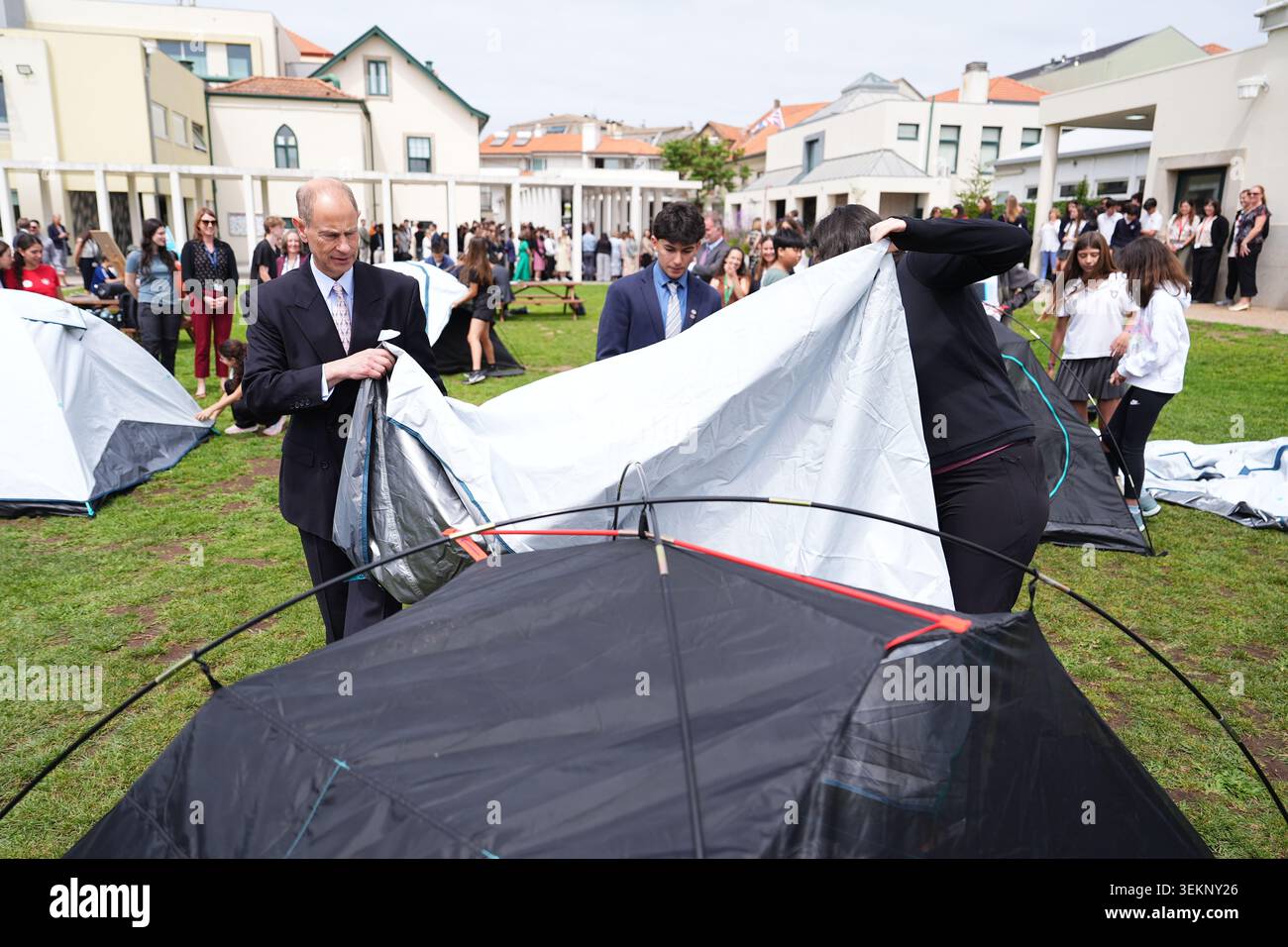 The Duke of Edinburgh assembling a tent at Oporto British School in ...